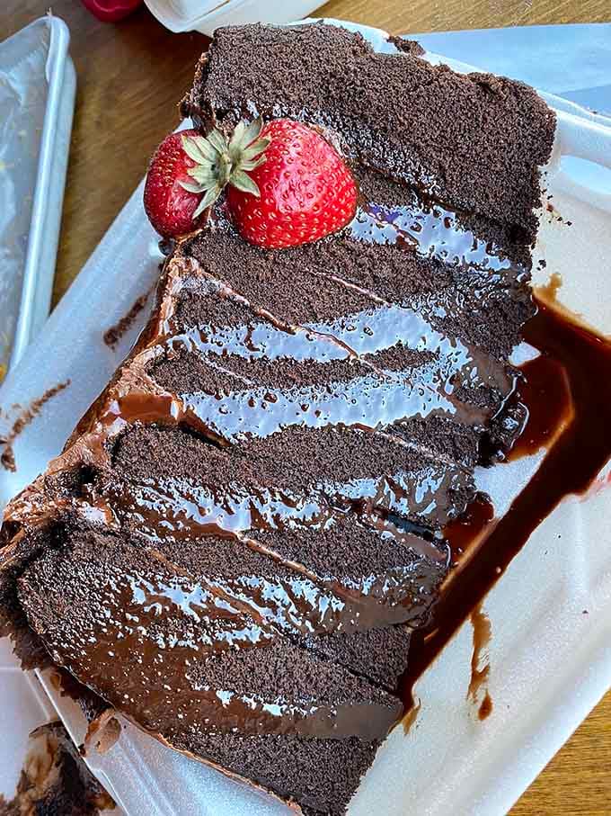 Nine layers of chocolate decadence that could make a cowboy weep with joy, topped with fresh strawberries.