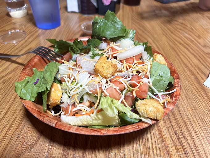 A fresh salad that doesn't feel like punishment &ndash; crisp, colorful, and actually crave-worthy alongside your burger indulgence.