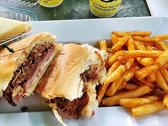 A proper Florida lunch spread featuring a hearty sandwich, golden fries, and the mandatory slice of Key lime pie &ndash; vacation on a plate!