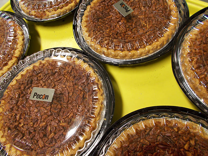Pecan pies lined up like edible works of art, ready to make any gathering instantly better and any diet instantly forgotten.