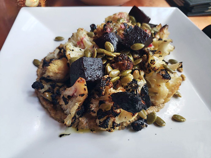 The Seared Cauliflower elevates the humble vegetable to star status, with toasted pepitas adding crunch to this beautifully charred plant-based masterpiece.