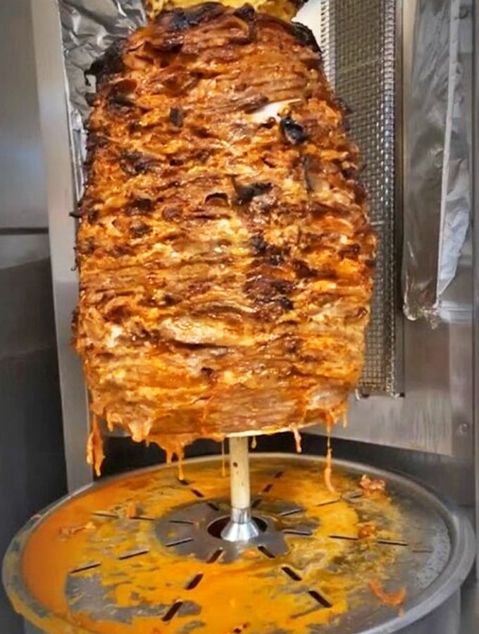 Behold, the al pastor in all its glory! This spinning tower of marinated pork is hypnotic. Watch it twirl, then taste the magic on your plate.