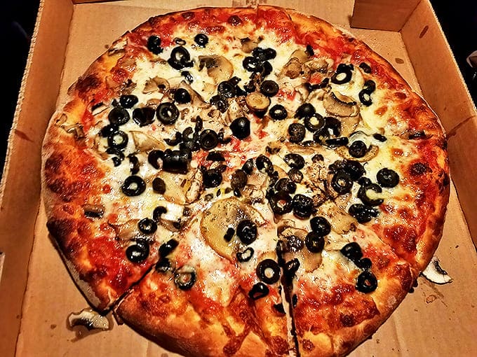 Siciliana: A Mediterranean vacation in every bite, this olive and mushroom masterpiece proves that sometimes more is more. The crust's char marks are like flavor tattoos.