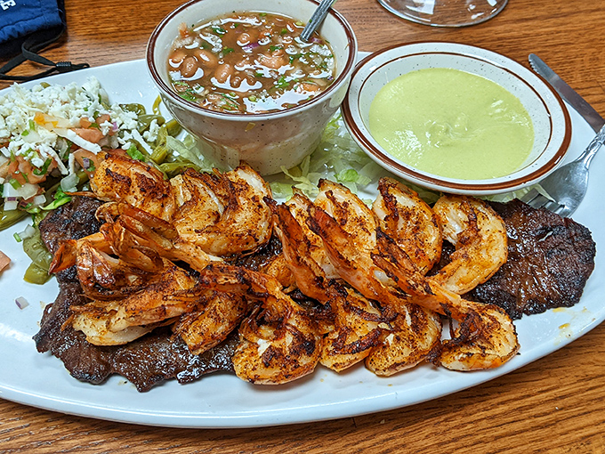 Surf and turf, La Quebrada style &ndash; succulent grilled shrimp alongside their famous steak, with two signature sauces for dipping.