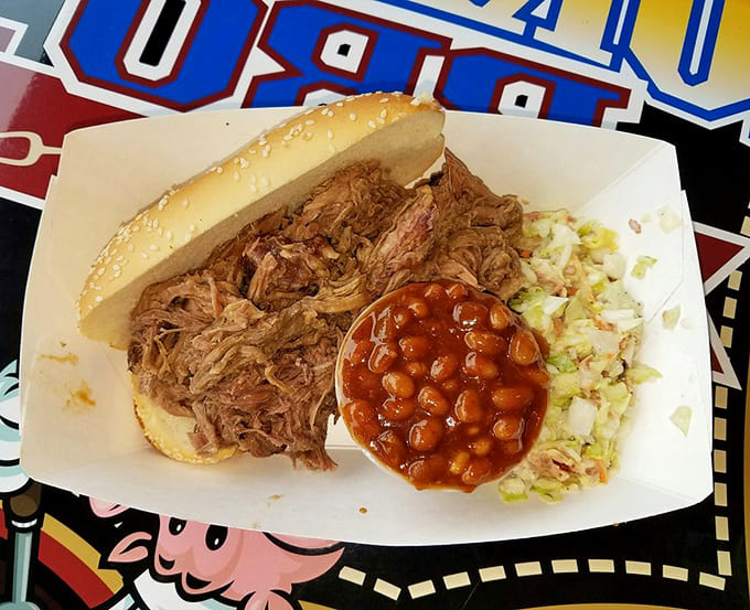 Pulled pork piled high with beans and slaw, the holy trinity of BBQ sides working together in perfect harmony.