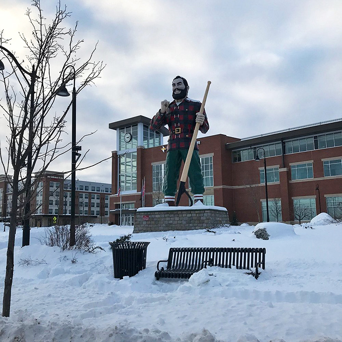 Winter in Maine doesn't faze this hardy lumberjack. Snow-covered but steadfast, Paul reminds visitors that true Mainers don't hibernate &ndash; they persevere.