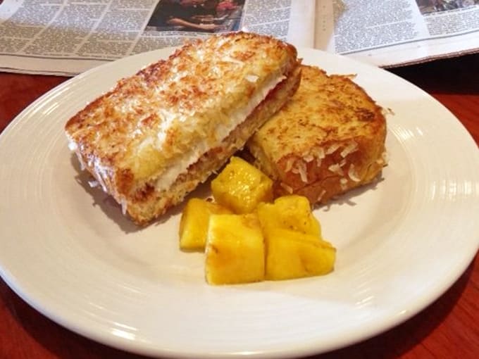 Golden-crisp French toast paired with sunshine-sweet pineapple chunks &ndash; Florida's breakfast answer to paradise found.