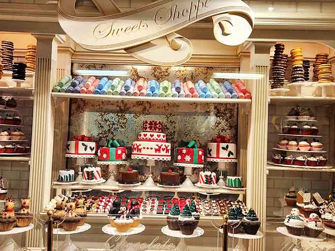 Sweet Shop delights await behind elegant columns, with colorful macarons and festive cakes that would make even Santa's elves jealous of your treat selection.