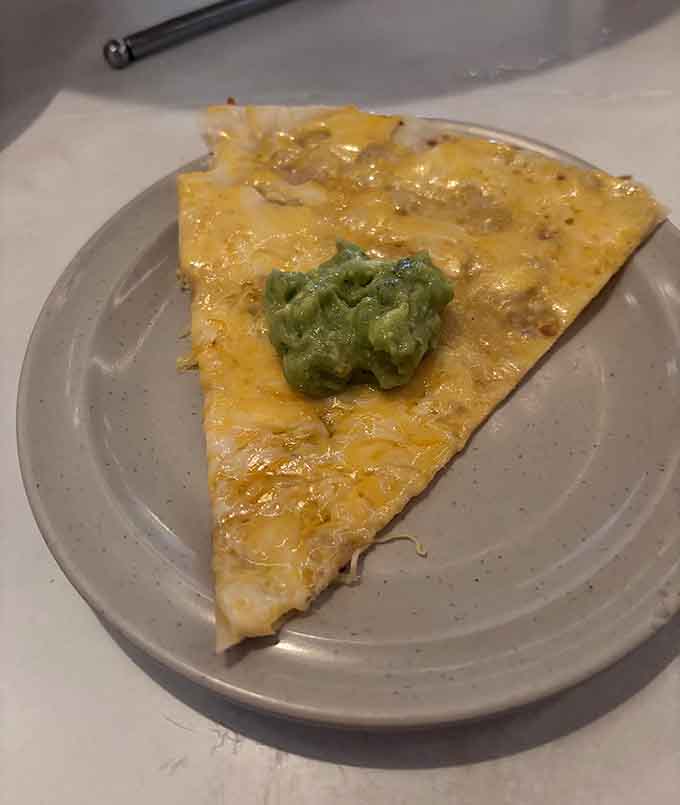 One slice reveals the beautiful marriage of crunch and cream, proving that sometimes the simplest combinations create the most memorable experiences.