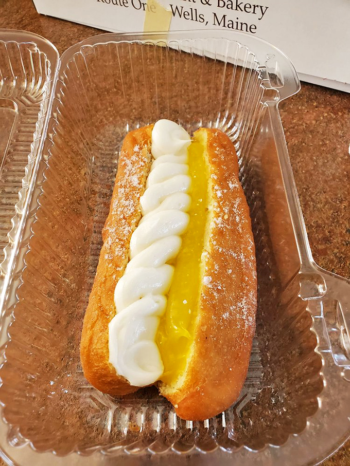 The Bismarck: where custard dreams come true, topped with a perfect ribbon of whipped cream that's practically begging to be photographed.