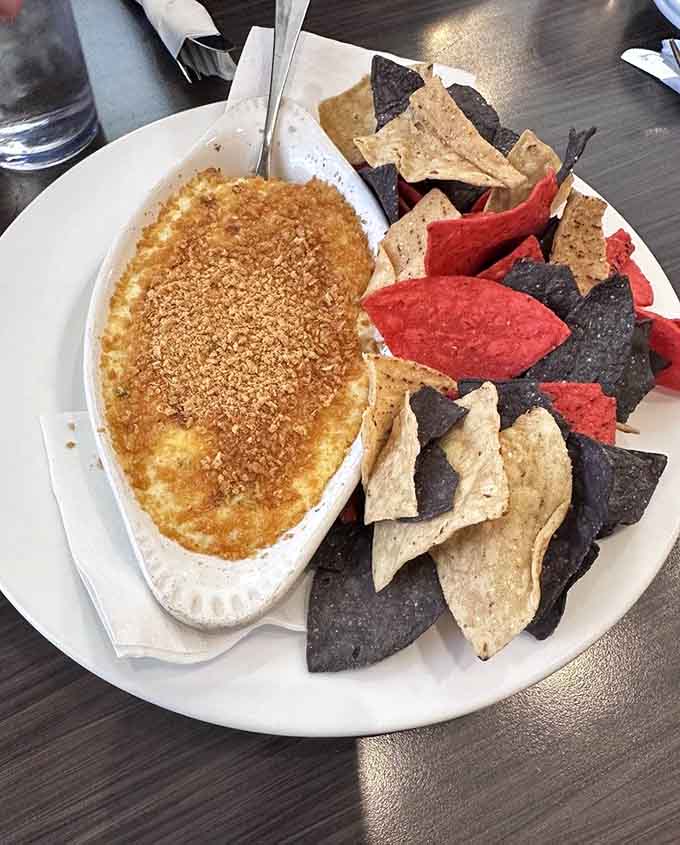 Jalapeño Popper Dip transforms the beloved appetizer into shareable, dippable form, dangerously addictive with those colorful chips.