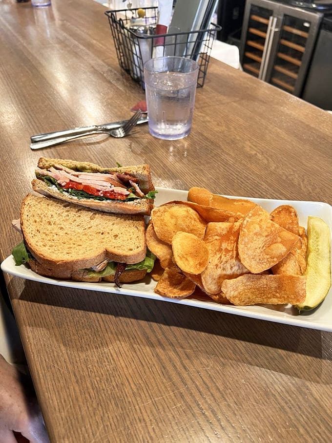 The turkey avocado club comes with house-made chips and a pickle, because sometimes classics just need quality execution to shine.