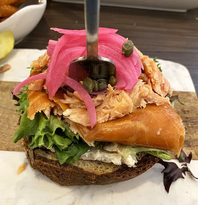 This sm&oslash;rrebr&oslash;d showcases Scandinavian heritage with style, topped with pickled onions that add the perfect tangy punch.