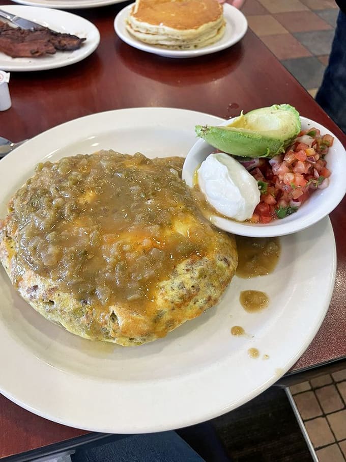 That green chili omelet brings southwestern flair to your breakfast plate, loaded with cheese and fresh salsa.