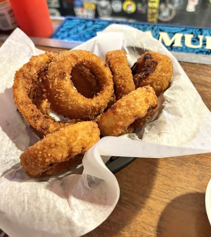 Golden rings of oniony goodness, breaded and fried until they achieve that perfect crunch that echoes through the restaurant with each bite.