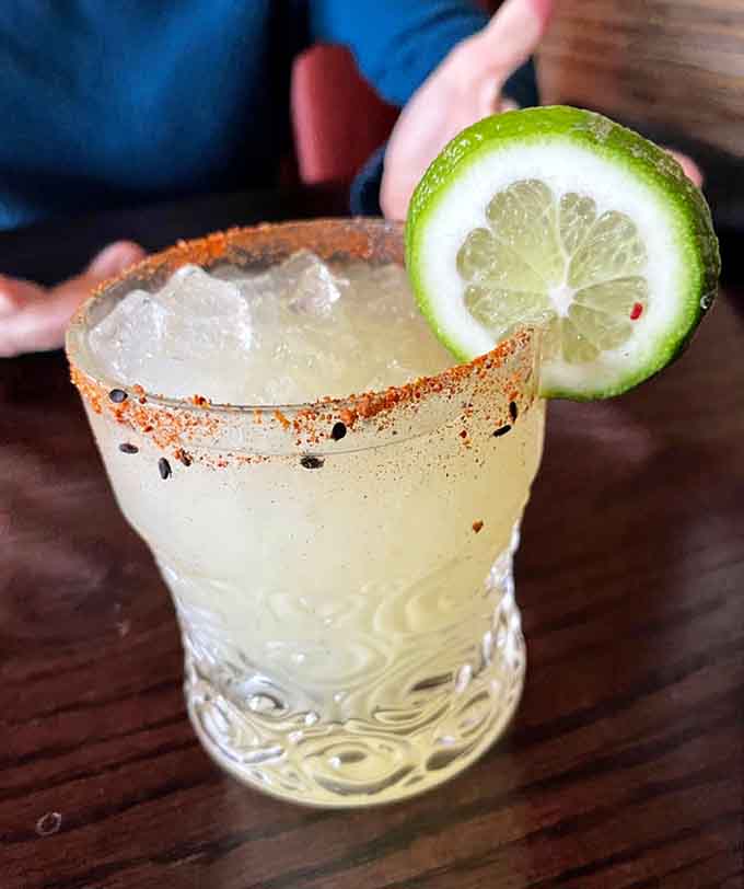 A margarita with a spicy rim brings unexpected heat, because who says you can't pair tequila with ramen when you're feeling adventurous?