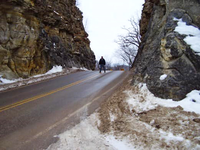 Winter's transformation: Snow and ice add dramatic contrast to the cut's rugged walls during Wisconsin's colder months.