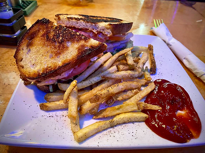 Turkey Club Sandwich: Architecture meets appetite in this perfectly stacked monument to sandwich craftsmanship.