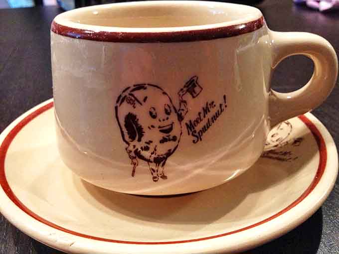 Vintage Mug: "Meet Mr. Spudnut!" This charming cup holds coffee strong enough to stand up to the donuts' sweet perfection.