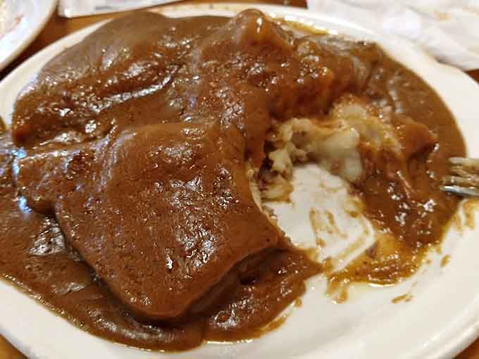 Roast beef swimming in rich gravy over white bread is comfort food that would make your grandmother nod approvingly from across the table.