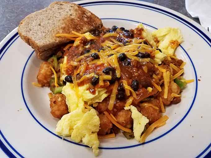 Loaded tater tots transform from humble side dish to main event, piled high with enough toppings to require structural support.