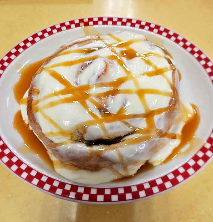 This cinnamon caramel roll requires serious commitment and possibly elastic waistbands, but regret is not an option here, friends.