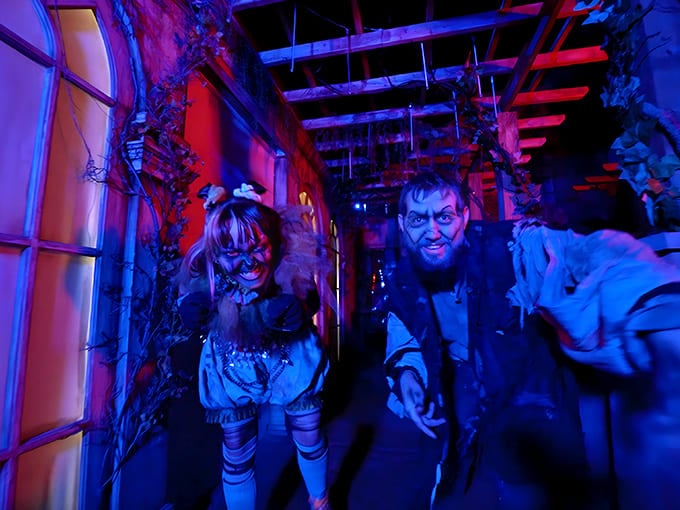 Performers in elaborate costumes create personalized scares, their training evident in how they time each terrifying moment for maximum impact.