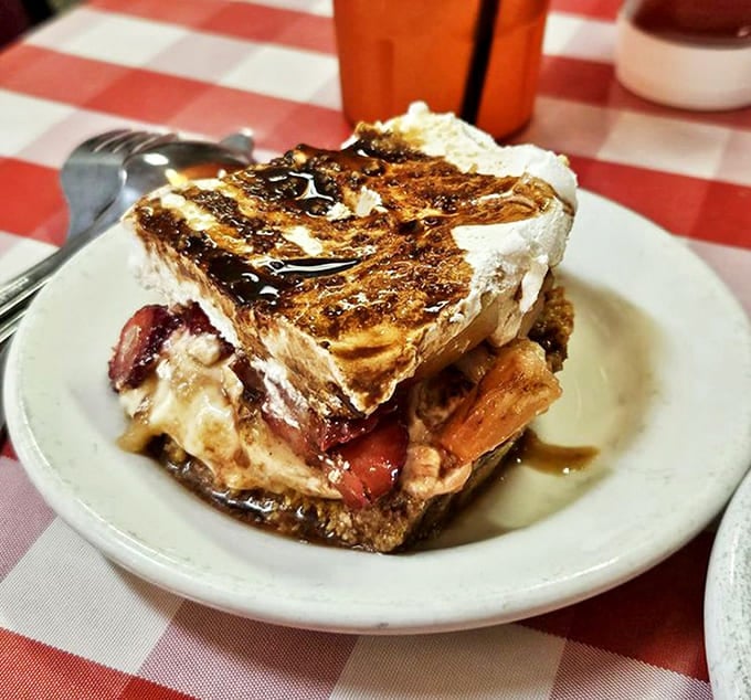 The banana split cake transforms a classic ice cream treat into sliceable joy, proving innovation still happens at old-school diners.