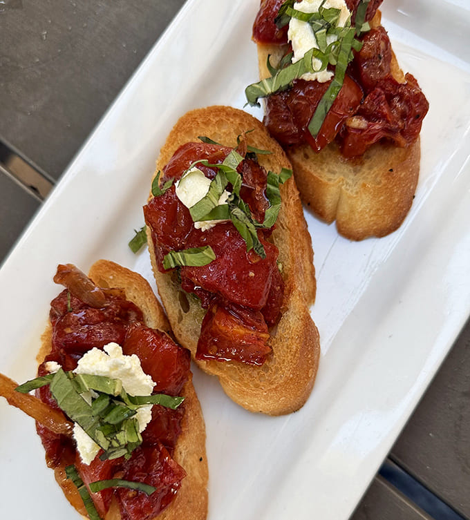 Bruschetta that puts ordinary toast to shame. These crunchy vessels carry sun-ripened tomatoes and fresh herbs to your taste buds with Italian flair.