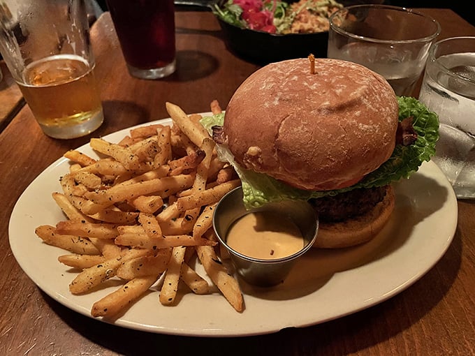 The perfect trifecta: a golden-brown bun, a perfectly cooked patty, and fries that somehow stay crispy until the very last one disappears.