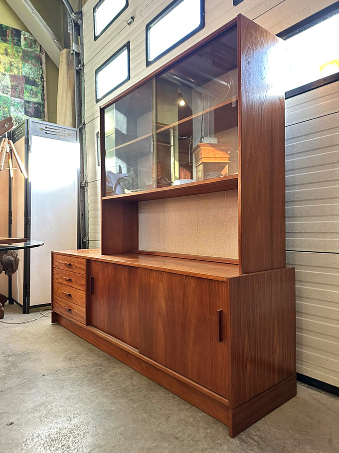 Not just storage, but a statement: this teak cabinet with glass display combines practicality with showmanship for your favorite collectibles.