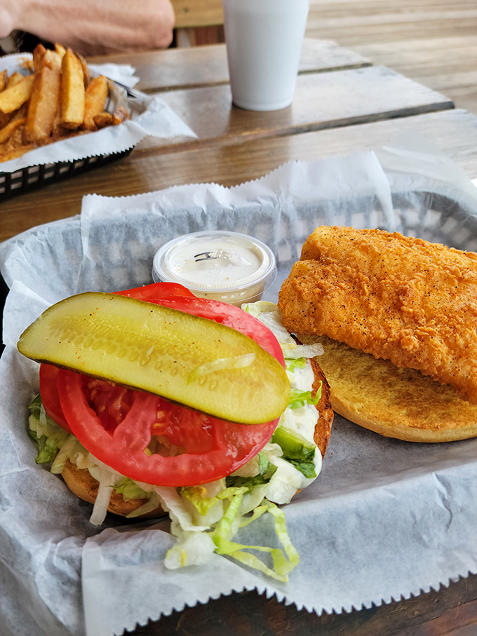 The fish sandwich arrives like summer on a bun&mdash;crispy, fresh, and adorned with all the right fixings.