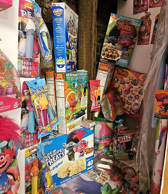 The "Trolls Eat What?" display features cereal boxes and food products that prove these creatures infiltrated our pantries too.