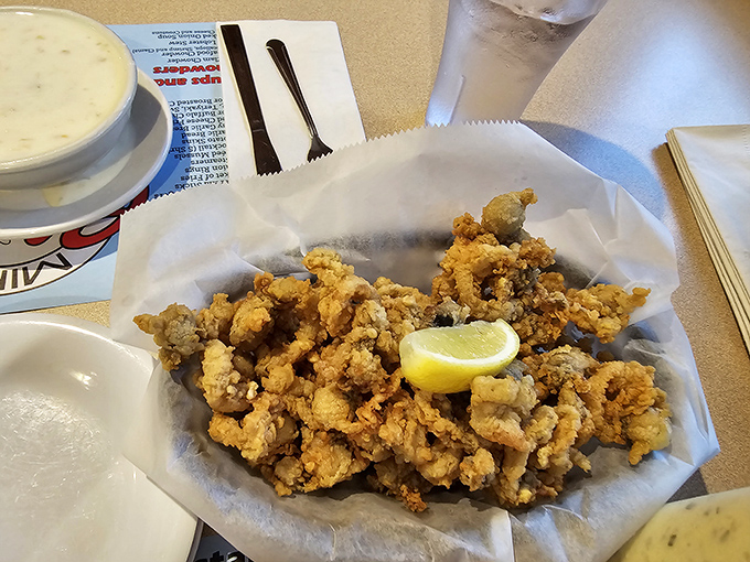 Clam heaven with a side of chowder – the perfect Maine meal that combines crispy fried goodness with creamy seafood comfort.