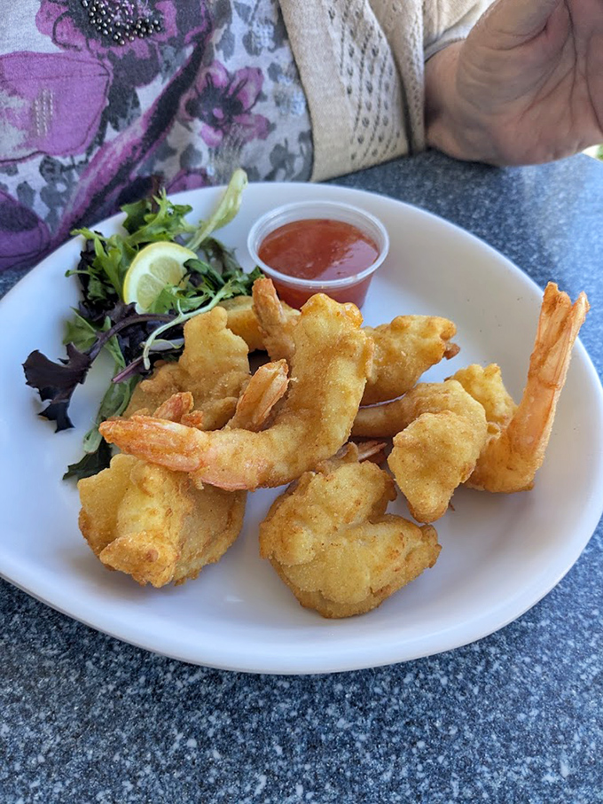 Light, crispy batter hugging plump shrimp &ndash; seafood perfection that tastes like a day at the beach.
