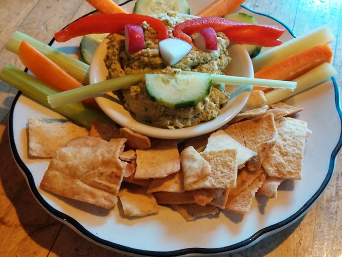 A rainbow of veggies surrounding a cloud of hummus&mdash;it's like nature and nurture had a delicious love child on your plate.