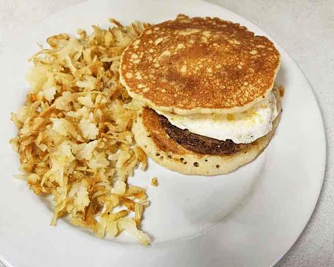 Pancake sandwich with sausage and egg: because sometimes you need your breakfast to be portable without sacrificing any of the good stuff.