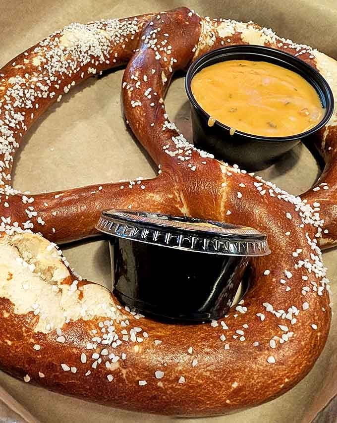 The Bavarian pretzel arrives like royalty &ndash; golden-brown, perfectly salted, and accompanied by dipping sauces that transform bread into an experience.