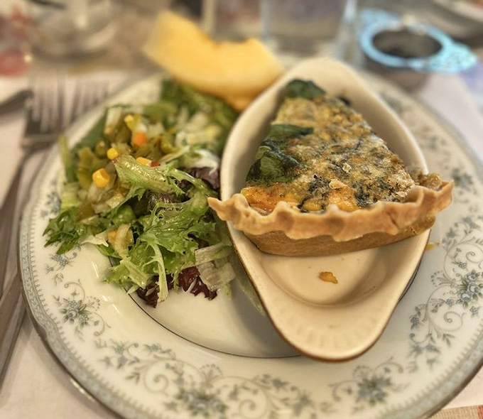 The quiche &ndash; a perfect marriage of flaky pastry and savory filling &ndash; sits alongside a fresh garden salad like old friends catching up.