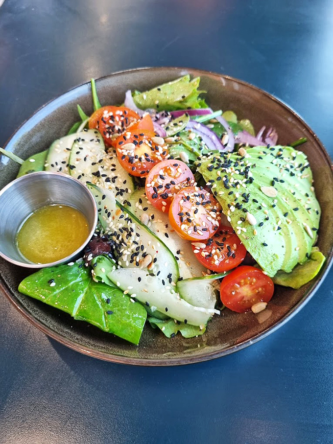 Salad that's actually exciting &ndash; fresh greens, perfect avocado, and black sesame seeds prove healthy eating doesn't have to be a punishment.