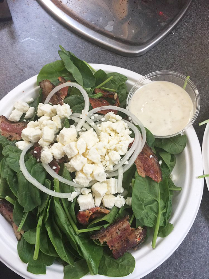 Even the salads here mean business &ndash; fresh greens, savory protein, and feta cheese create a lunch that satisfies without the usual salad-induced disappointment.