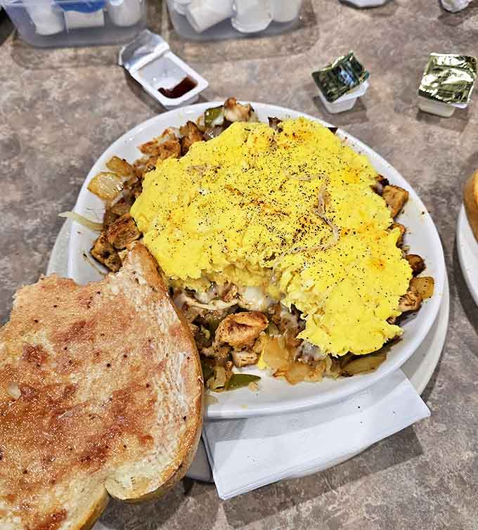 This hearty creation doesn't just feed your hunger &ndash; it feeds your soul with layers of comfort topped with perfectly scrambled eggs.