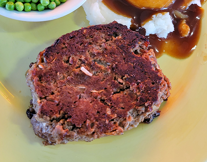 A closer look at the meatloaf reveals the perfect texture &ndash; substantial yet tender, with seasonings that complement rather than overwhelm.
