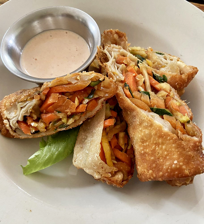 Behold, the spring rolls that launched a thousand food pilgrimages! Crispy, fresh, and served with a sauce that will make you want to lick the plate.