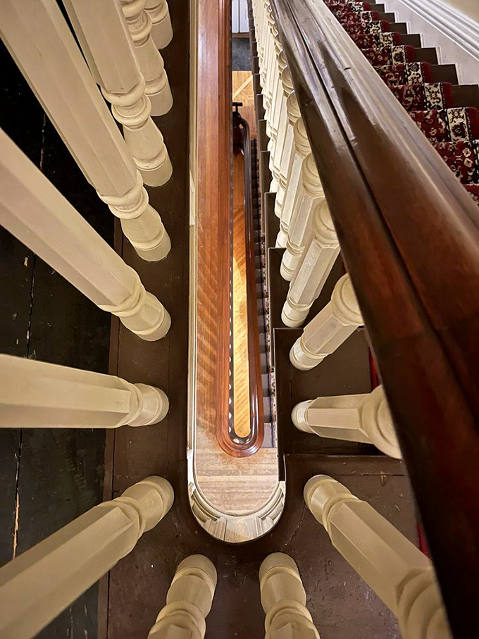 Looking down the mansion's staircase reveals craftsmanship so precise it makes modern construction seem like a hasty afterthought.