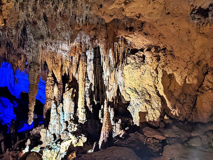 Limestone columns stand like ancient sentinels, silently witnessing the slow dance of water and mineral that continues to shape these caverns.