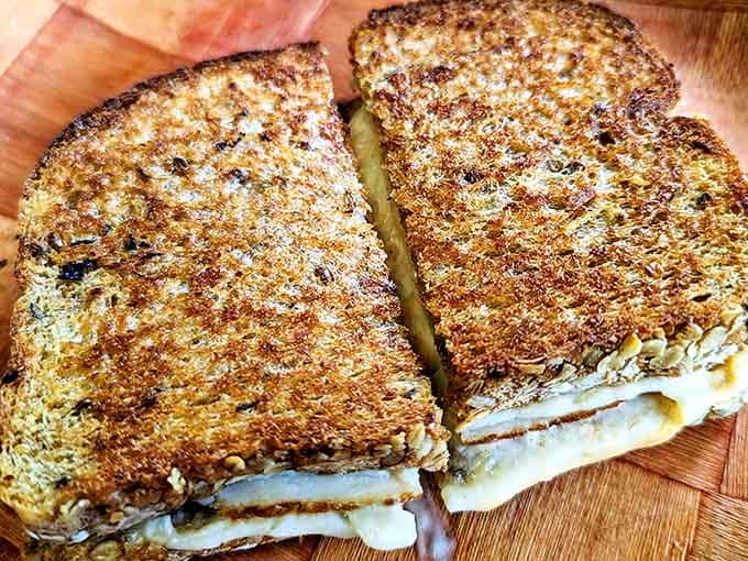 This isn't just a sandwich, it's a masterpiece of melted cheese architecture with perfectly golden bread that crackles with each bite.