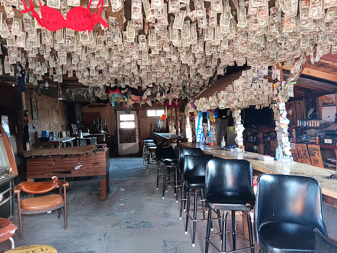 Where rustic charm meets "did they run out of nails?" This quirky tavern proves that sometimes, the best structures are held together by good vibes.