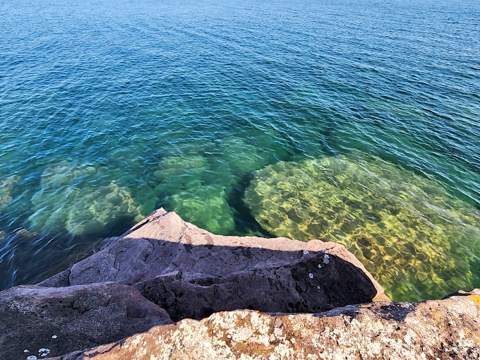 Calm waters and a sandy shore create the perfect canvas for a day of relaxation or adventure.