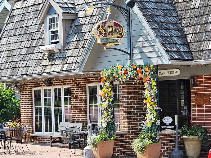 Where flowers bloom and appetites zoom. This inviting entrance promises a feast for both eyes and stomach.